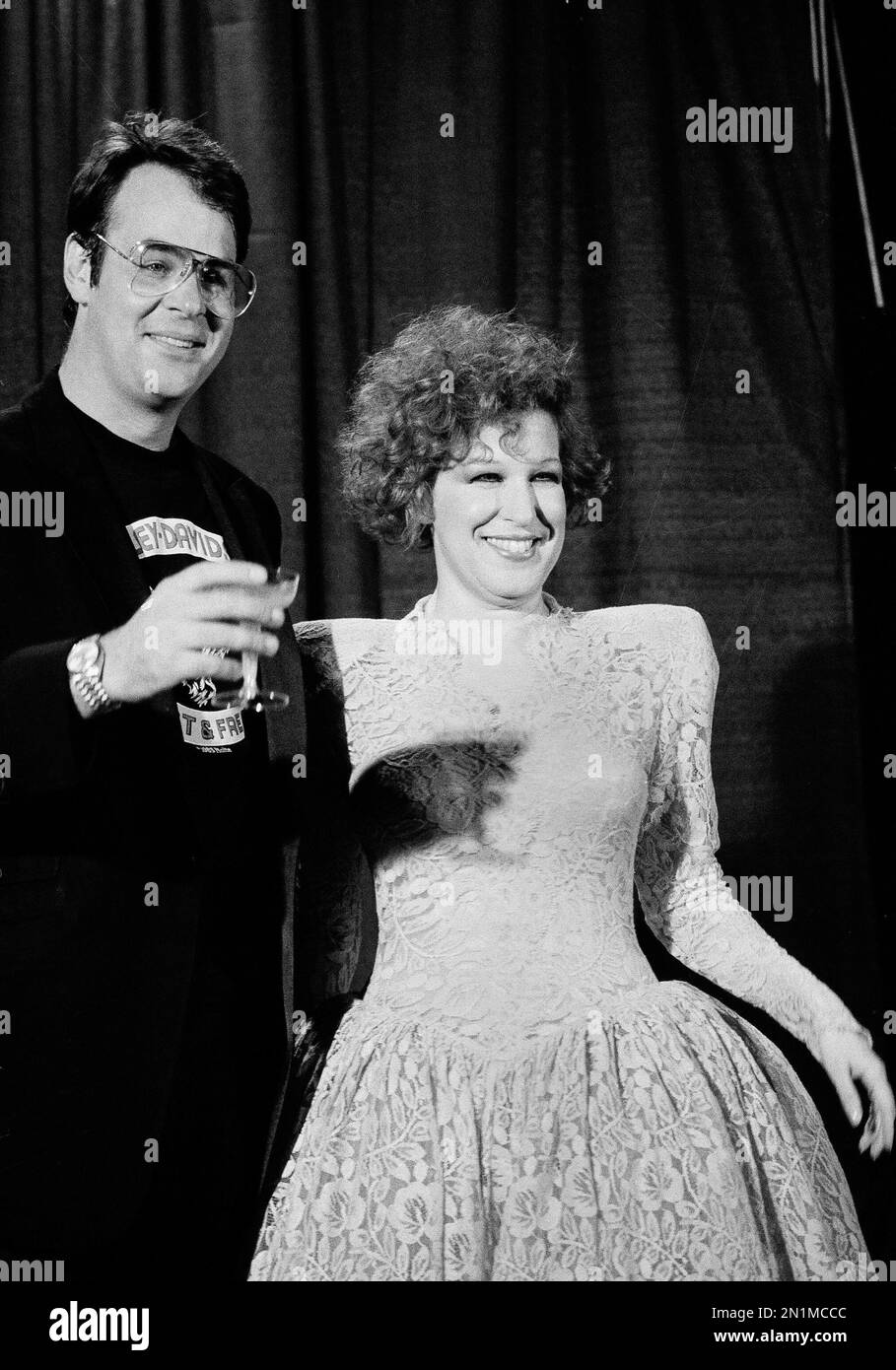 FILE - This Sept. 14, 1984 file photo shows, Dan Aykroyd, left, and Bette Midler, hosts of the ...