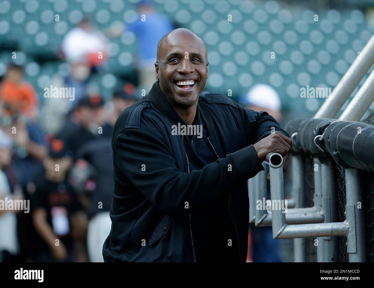 Former baseball player Barry Bonds smiles before a baseball game ...