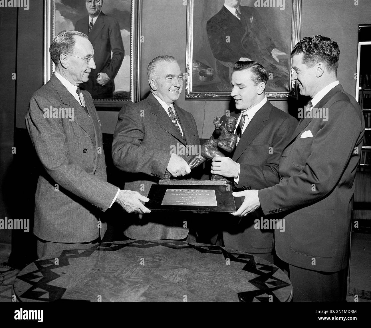The Heisman trophy is presented to Vic Janowicz of Ohio State, second ...