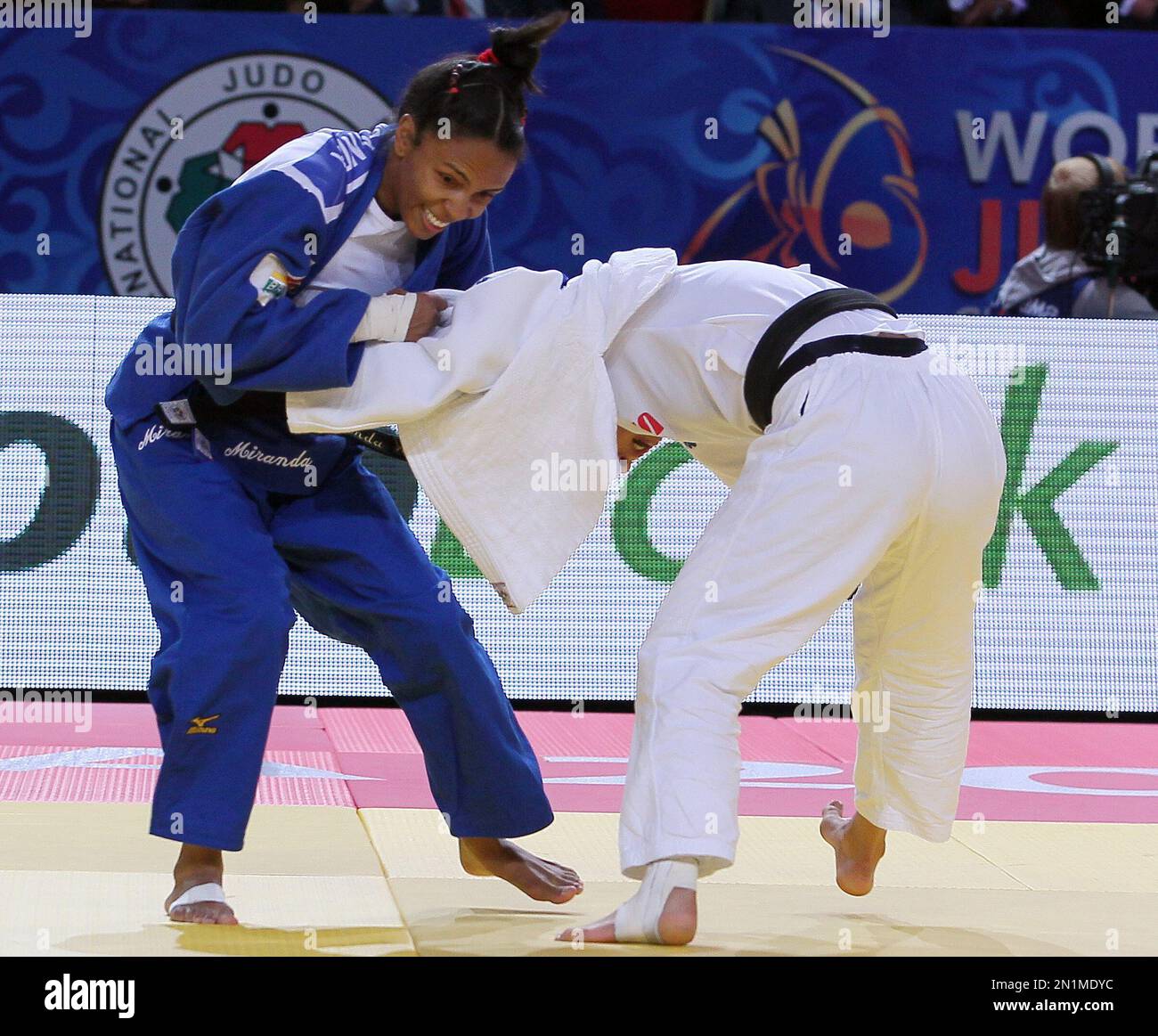 Brazil's Erika Miranda, left, competes against Italy's Odette Giuffrida ...
