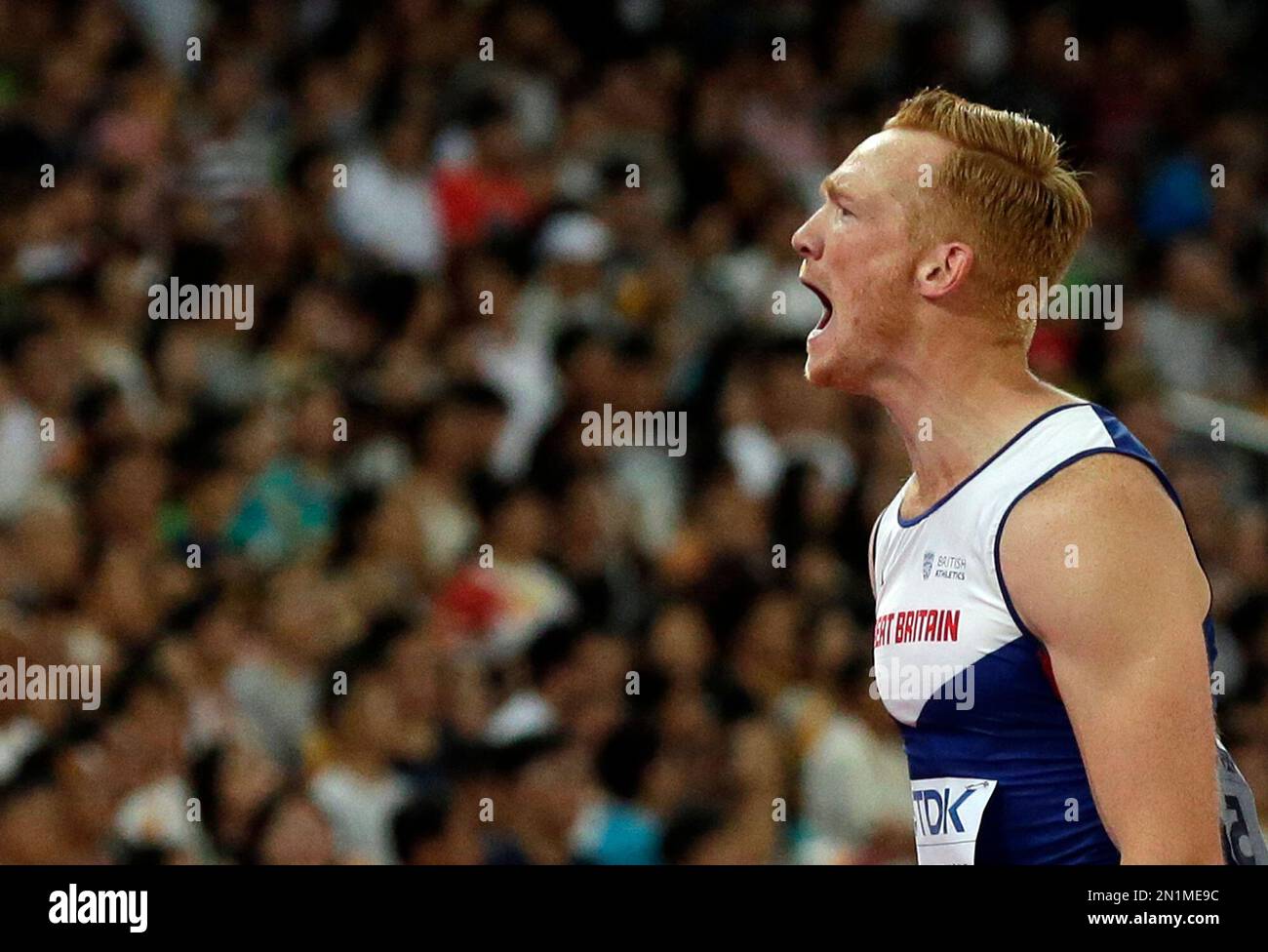Britain's Greg Rutherford celebrates on his way to winning the gold ...