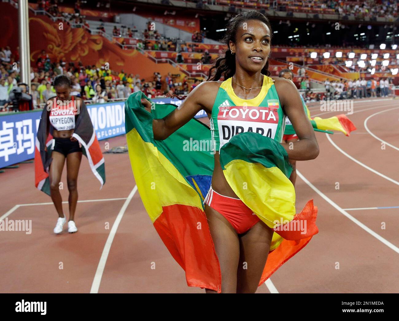 Ethiopia's Genzebe Dibaba celebrates after winning the gold medal in ...