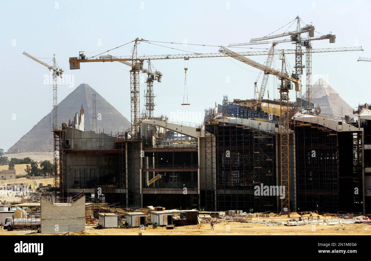 Cranes work at the site of Egypt's Grand museum, near the Giza Pyramids ...
