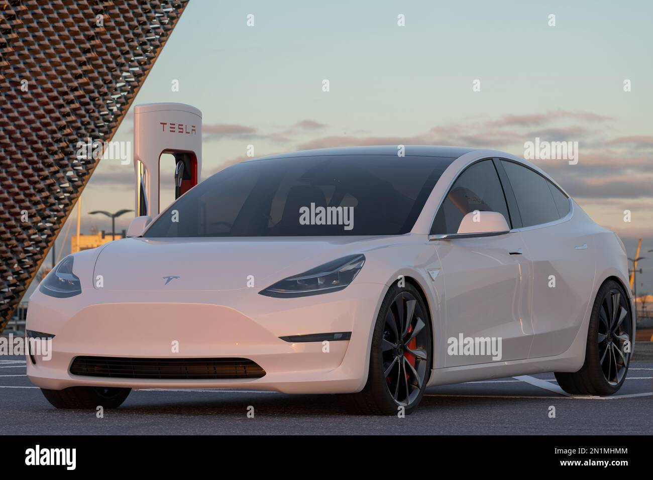 Tesla Model 3 at the charging station Stock Photo - Alamy