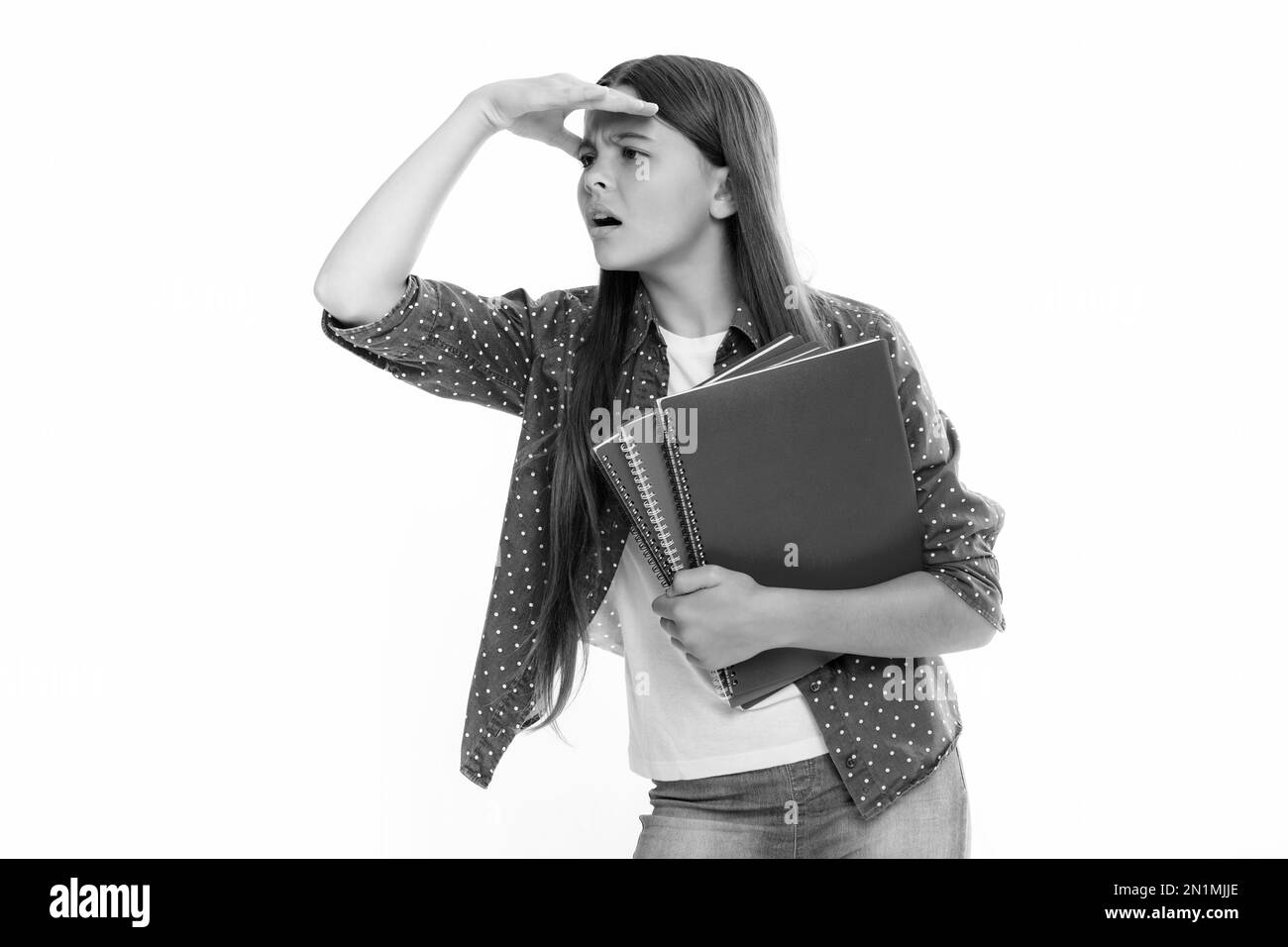 Teenager school girl with books isolated studio background. Angry ...
