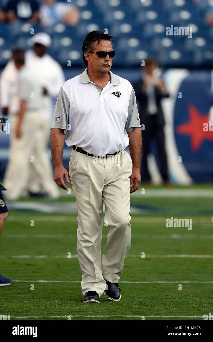 St. Louis Rams head coach Jeff Fisher watches players warm up before a ...
