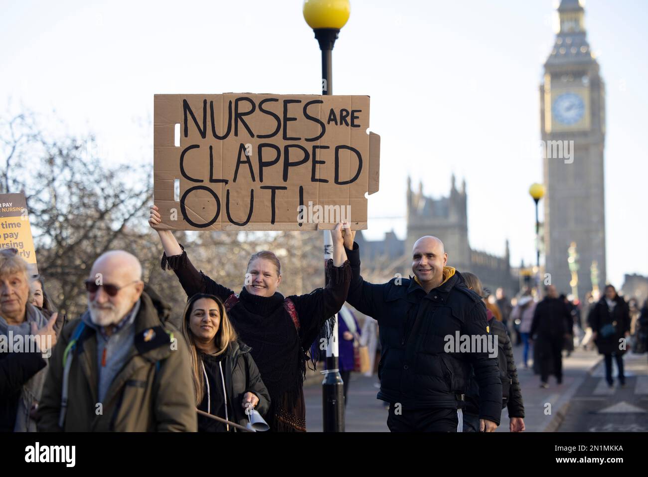 Protesters hold a placard expressing their opinion outside the St ...