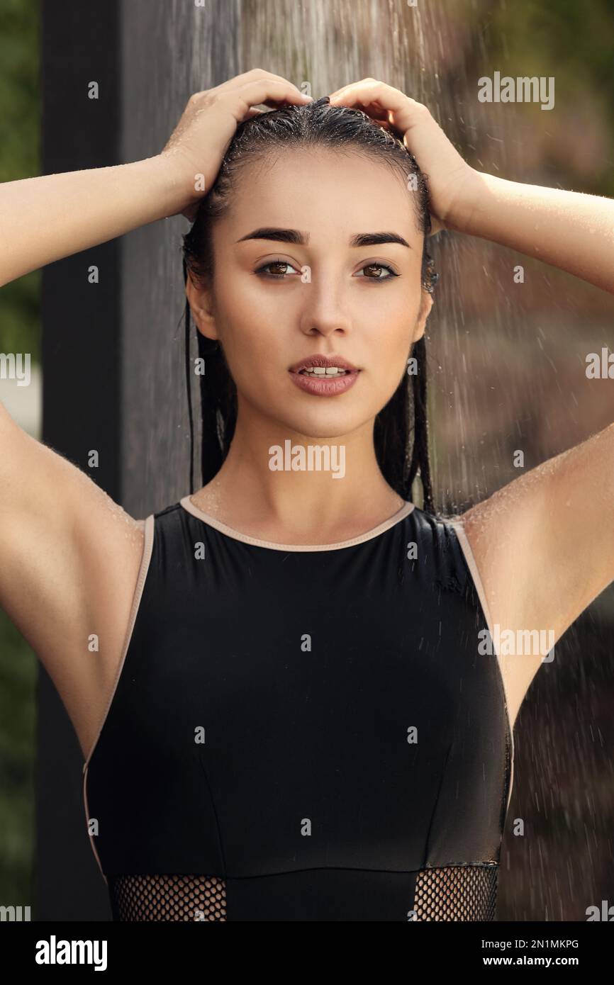 Woman washing hair in outdoor shower on summer day Stock Photo - Alamy