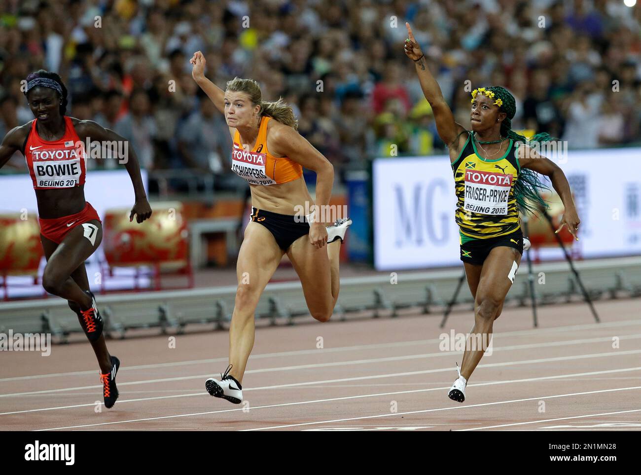 Jamaica's Shelly-Ann Fraser-Pryce, right, celebrates as she crosses the ...