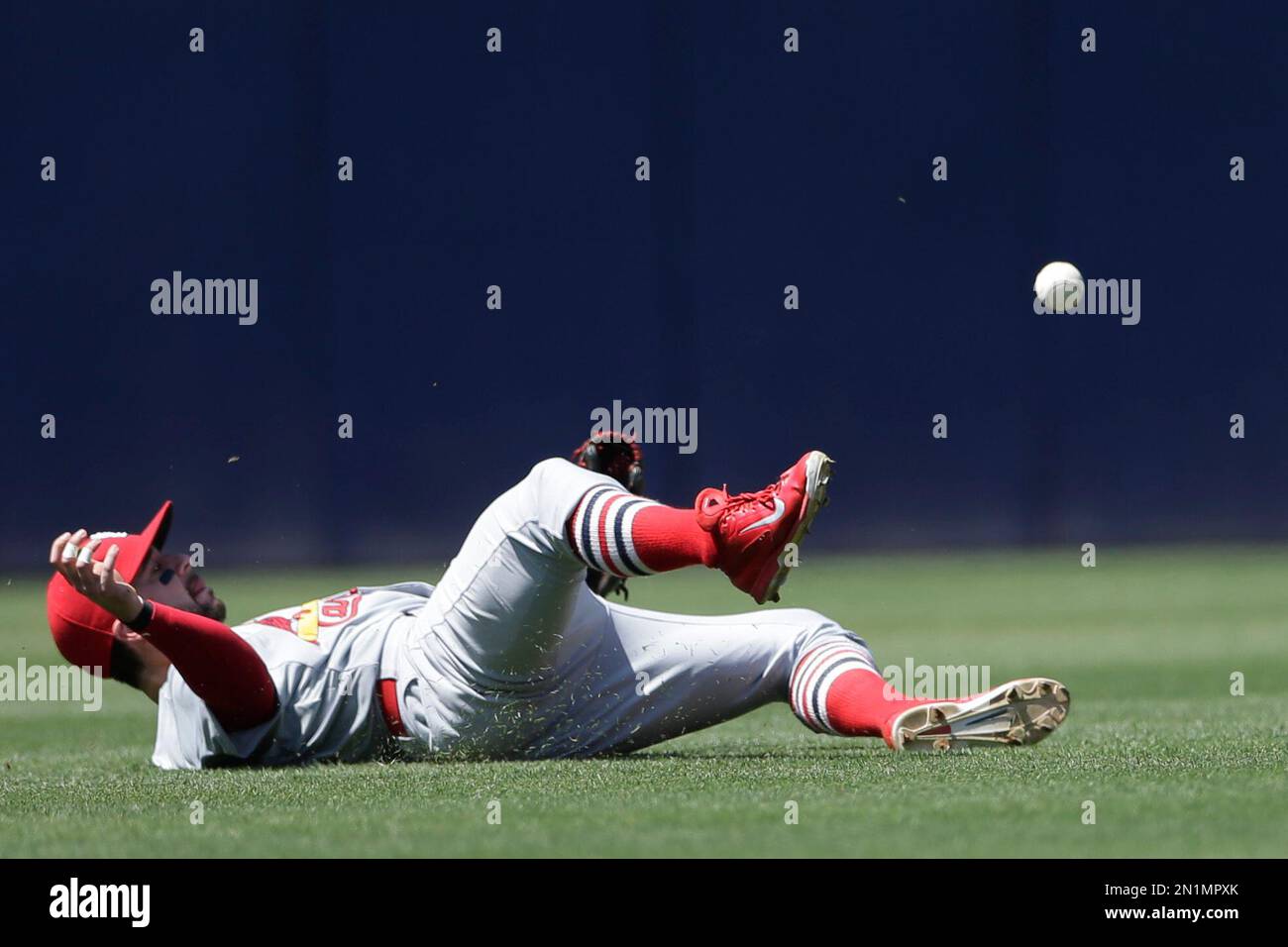 St. Louis Cardinals second baseman Greg Garcia misses the ball hit for ...