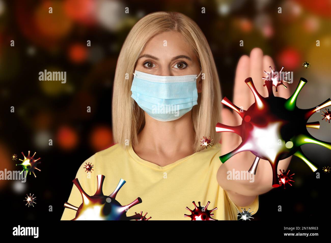 Be healthy - boost your immunity. Woman in protective mask showing stop ...