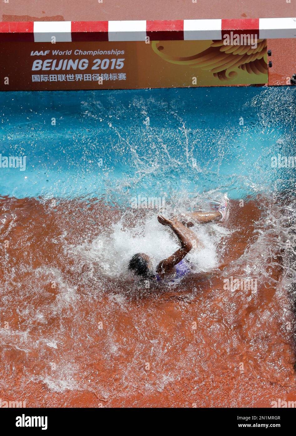 Panama's Rolanda Bell falls at the water jump during a heat in the ...