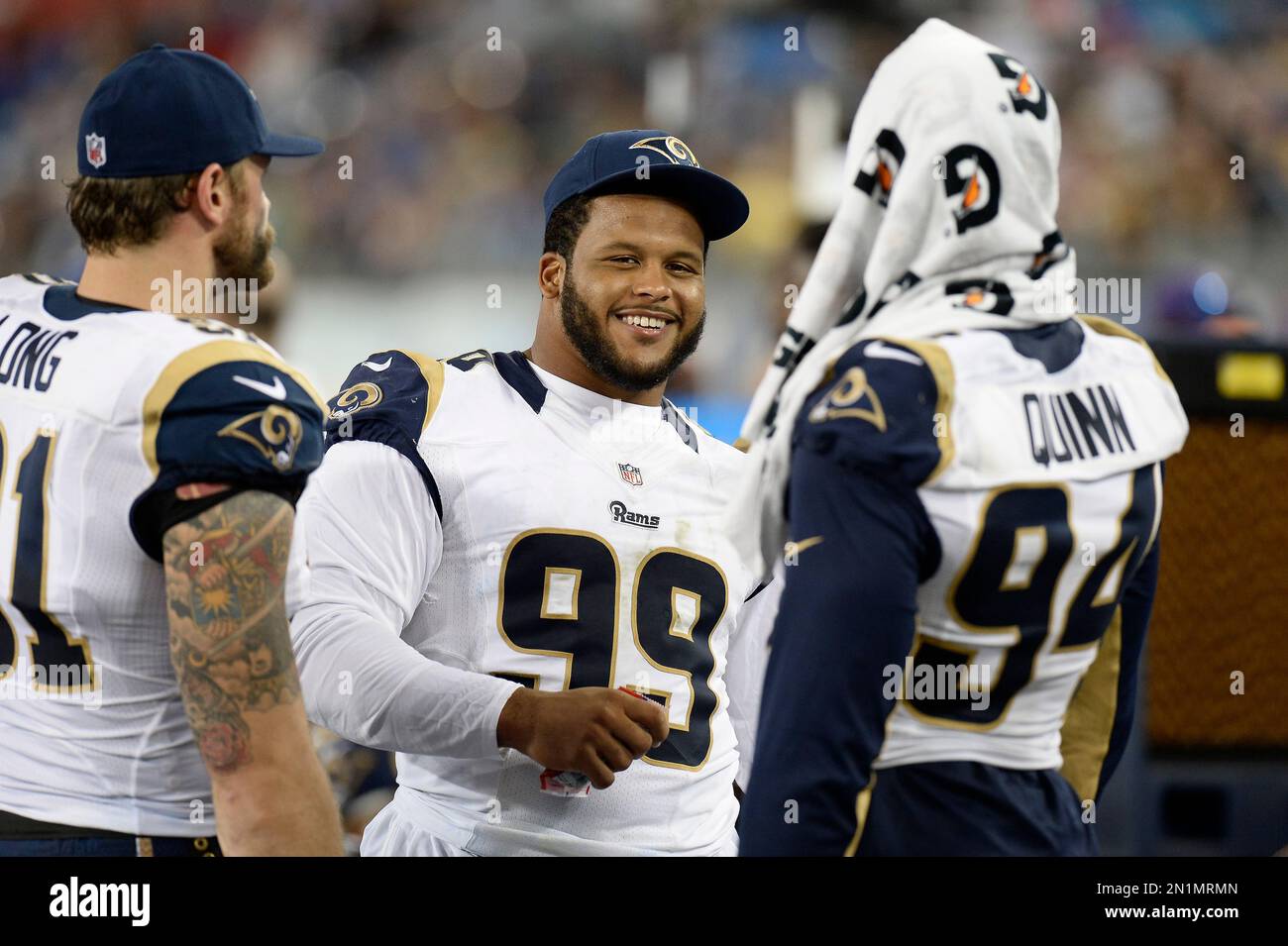 St. Louis Rams defensive tackle Aaron Donald (99) talks with teammates ...