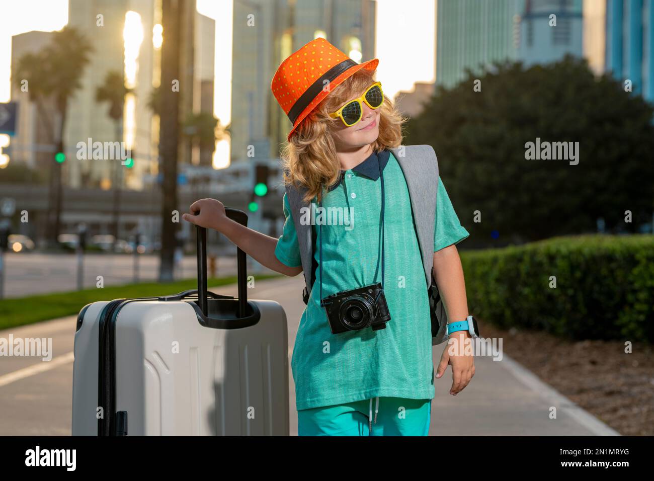 Child with suitcase going on vacation. Tourist boy on holiday, travel ...