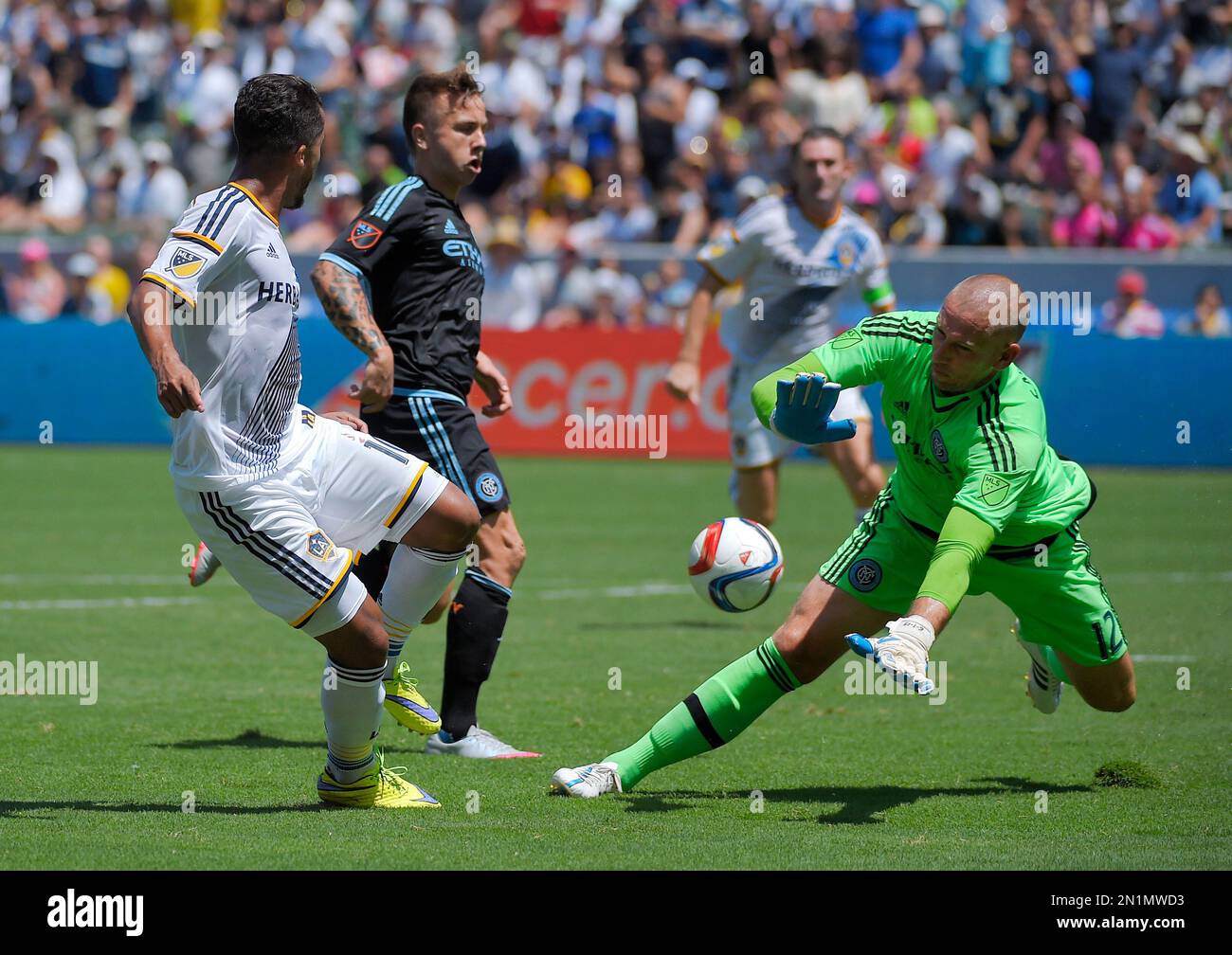 New York City FC goalkeeper Josh Saunders, right, stops a shot by Los ...
