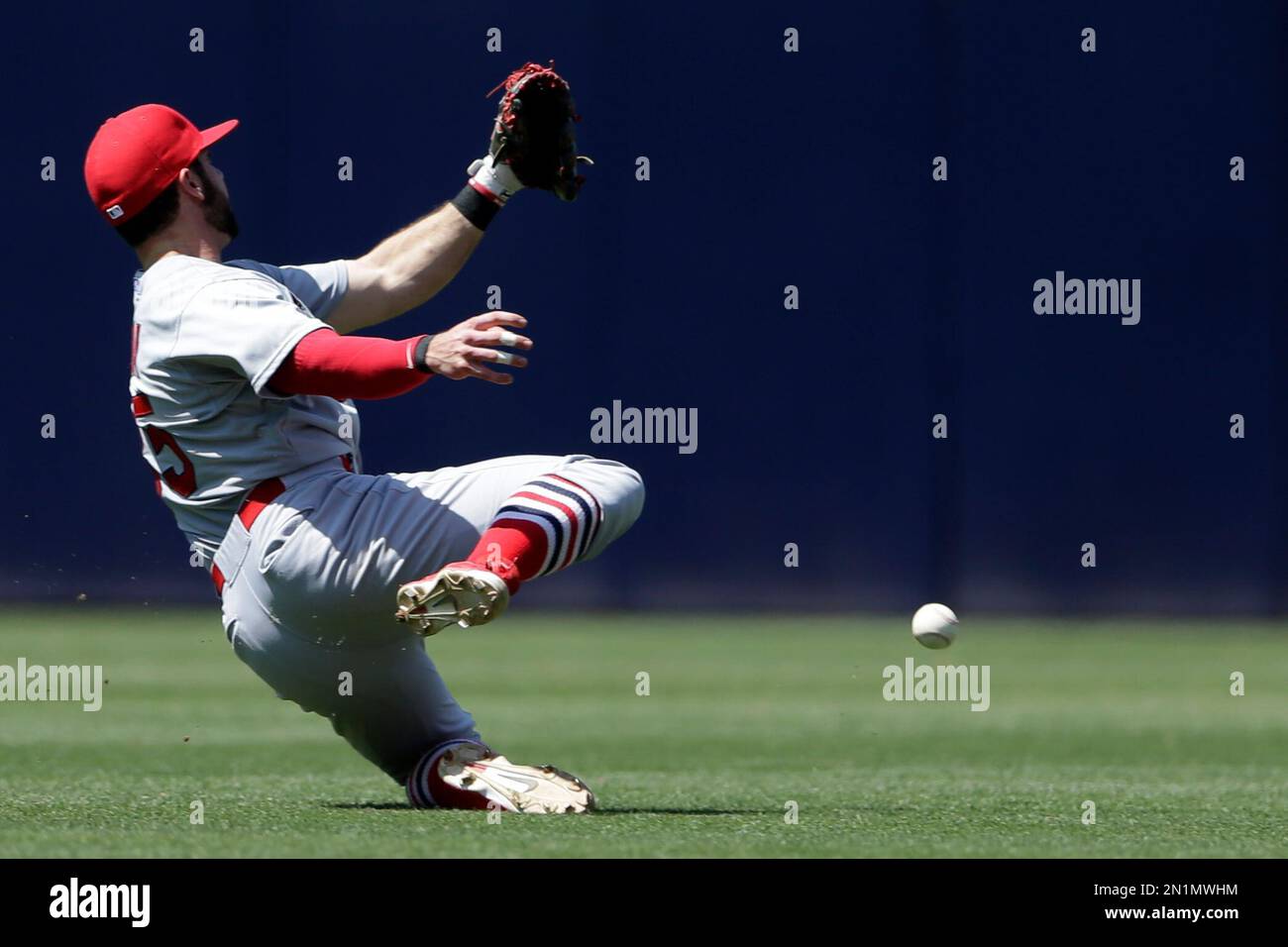 St. Louis Cardinals second baseman Greg Garcia misses the ball on a ...
