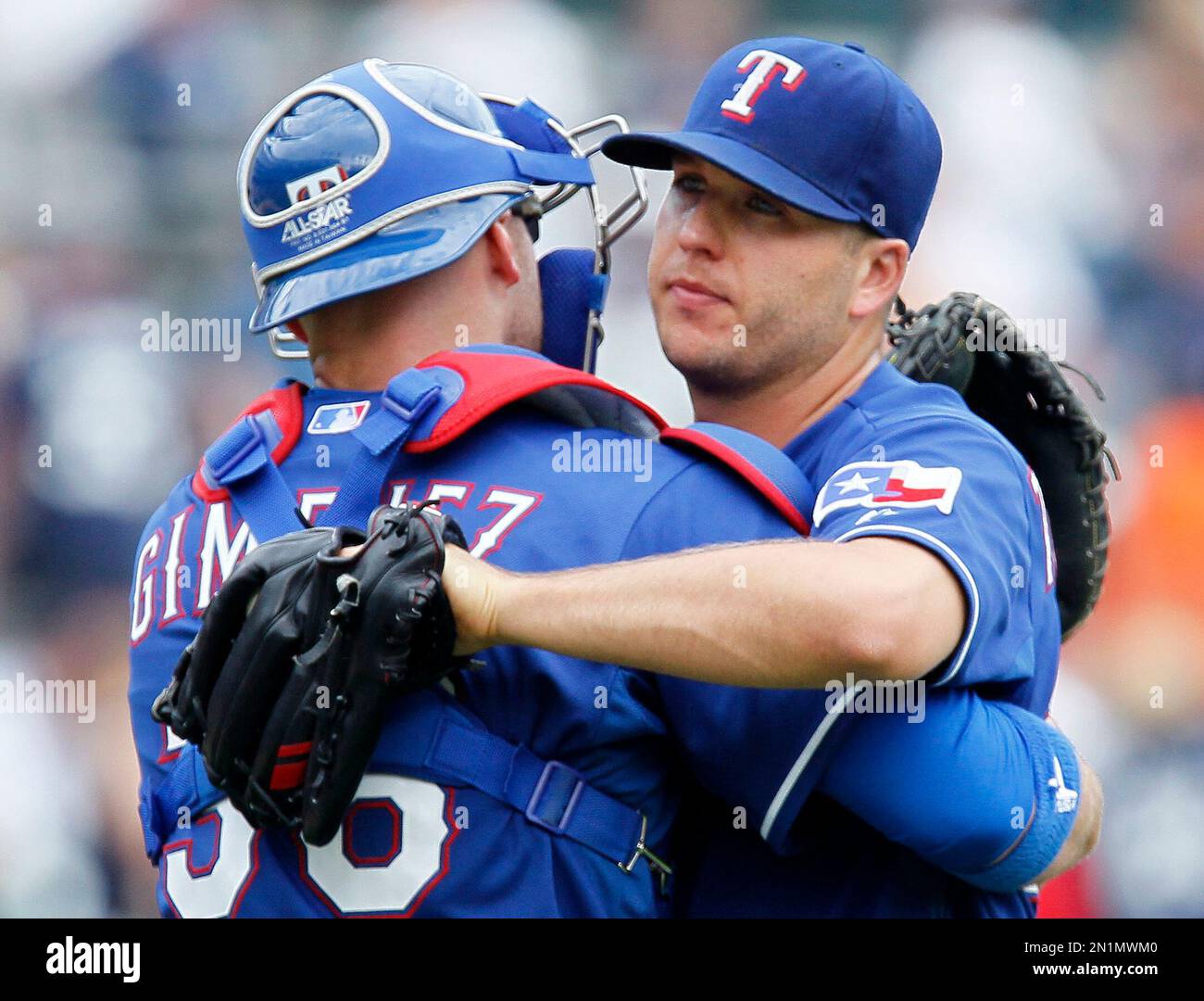 Texas Rangers' Shawn Tolleson, right, is hugged by catcher Chris ...
