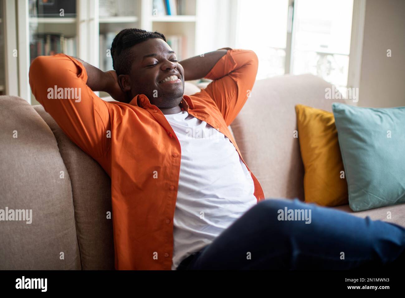 Relaxed black guy reclining hi-res stock photography and images - Alamy