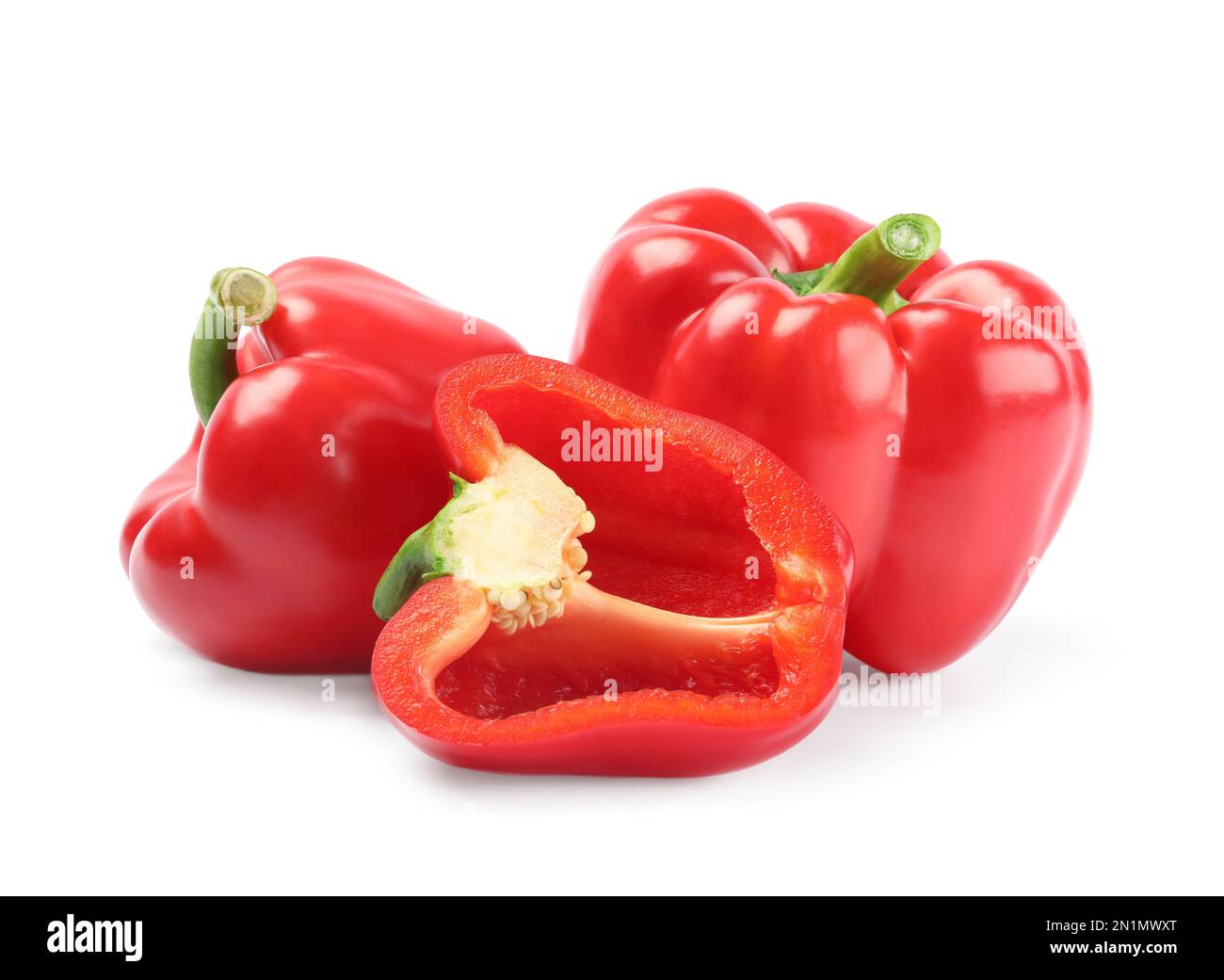 Whole and cut red bell peppers on white background Stock Photo - Alamy