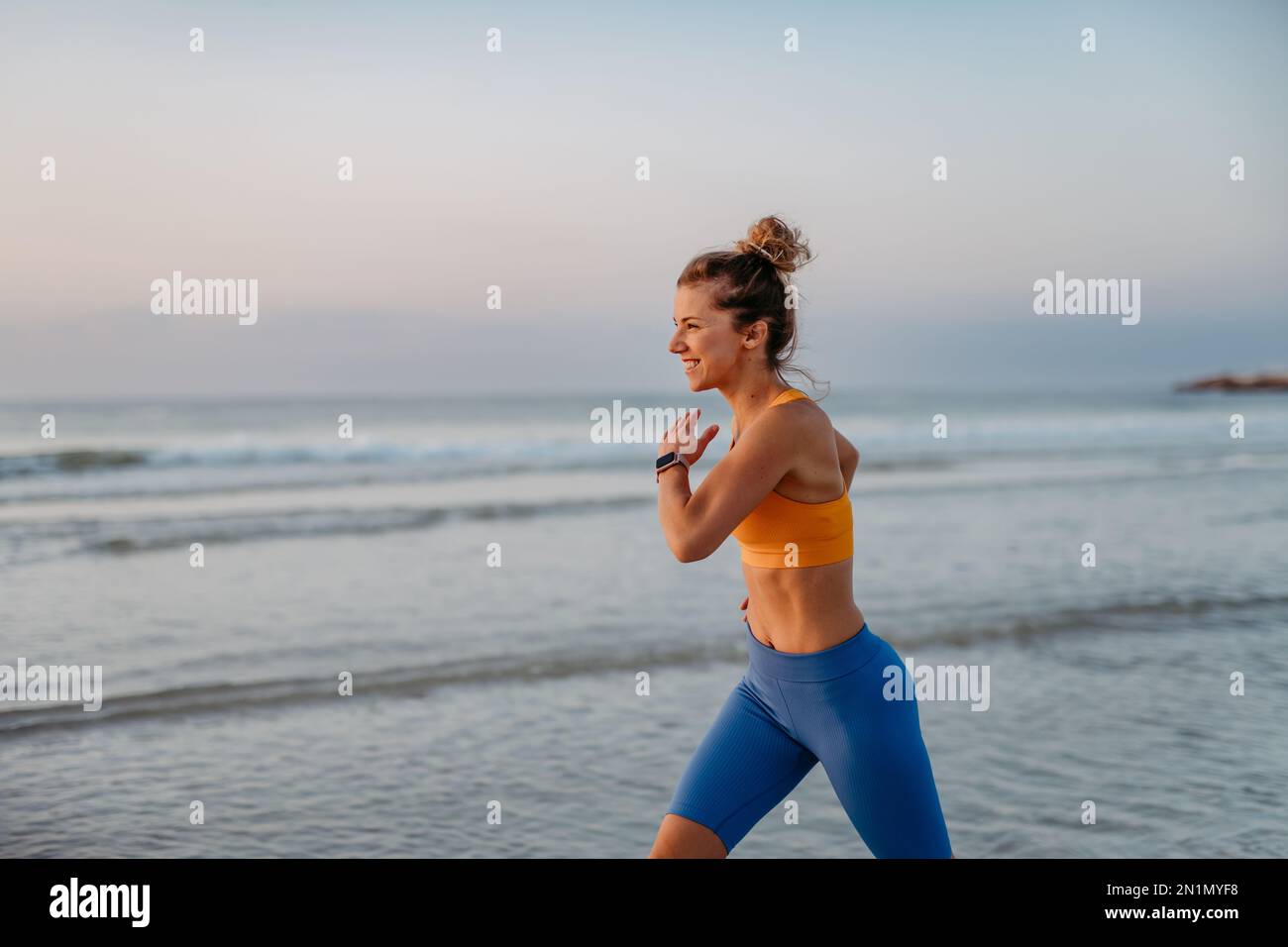 Young woman running at beach, morning routine and healthy lifestyle ...
