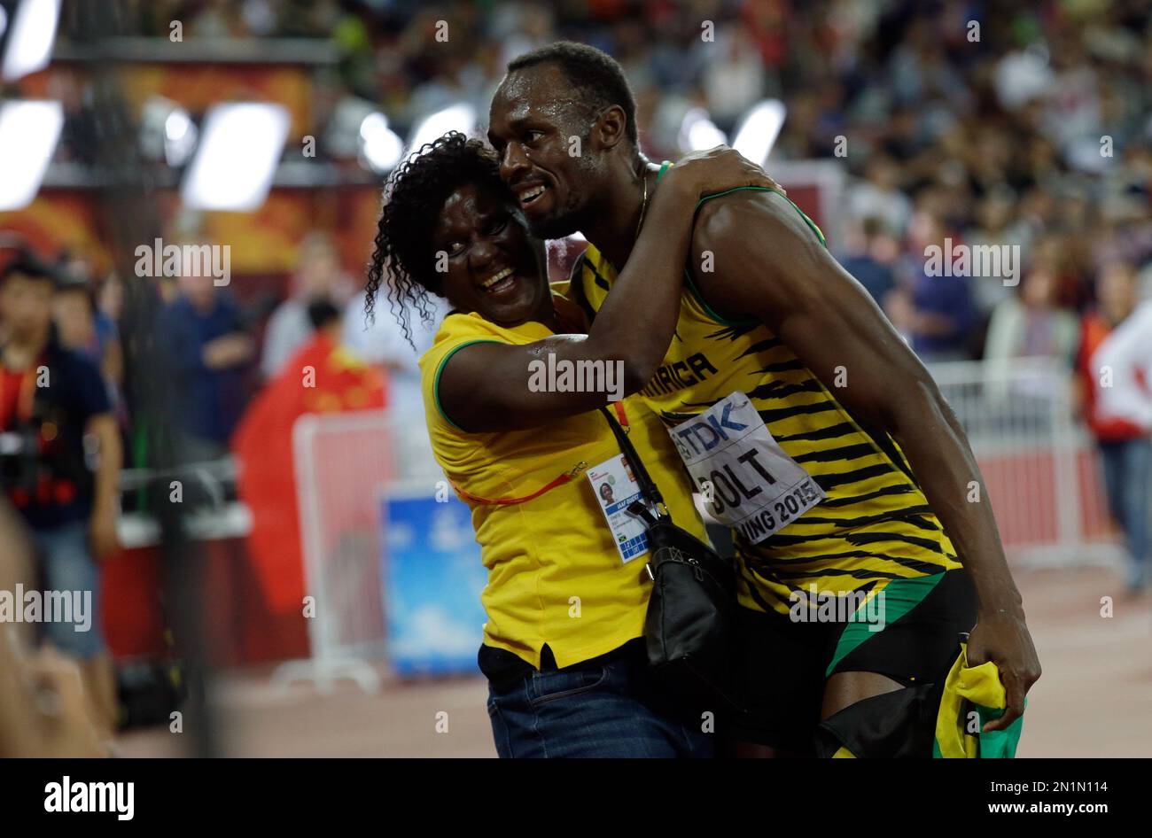 Jamaica's Usain Bolt gets a hug from his mother Jennifer Bolt after ...