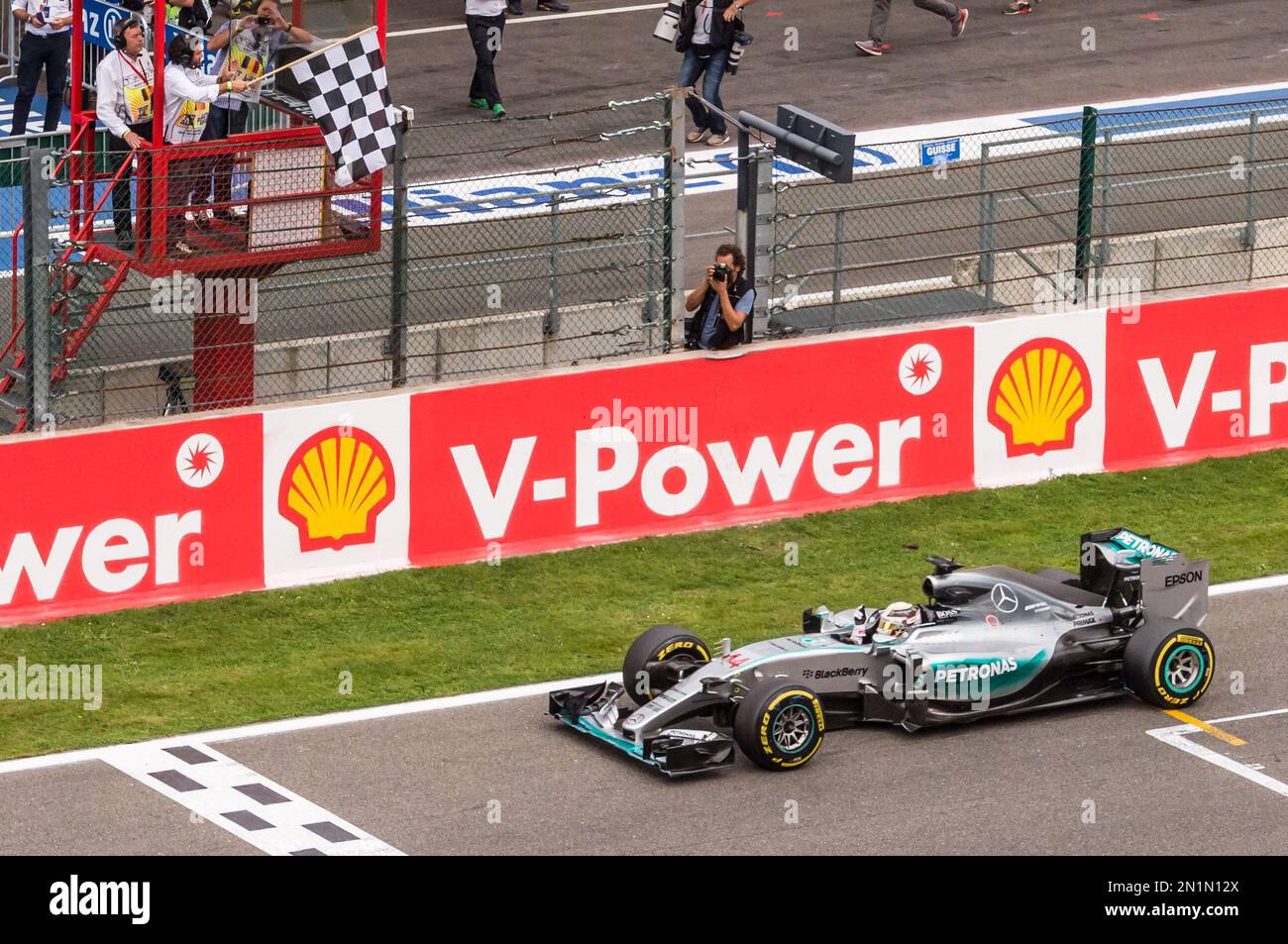 Mercedes driver Lewis Hamilton of Britain crosses the finish line to ...