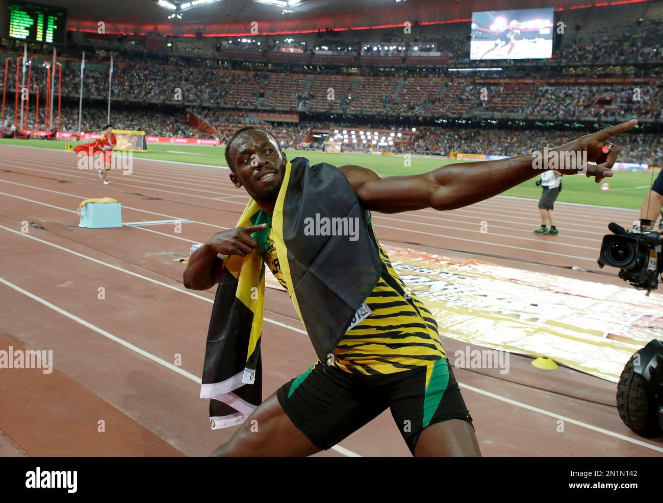 Jamaica's Usain Bolt celebrates after winning the gold medal in the men ...