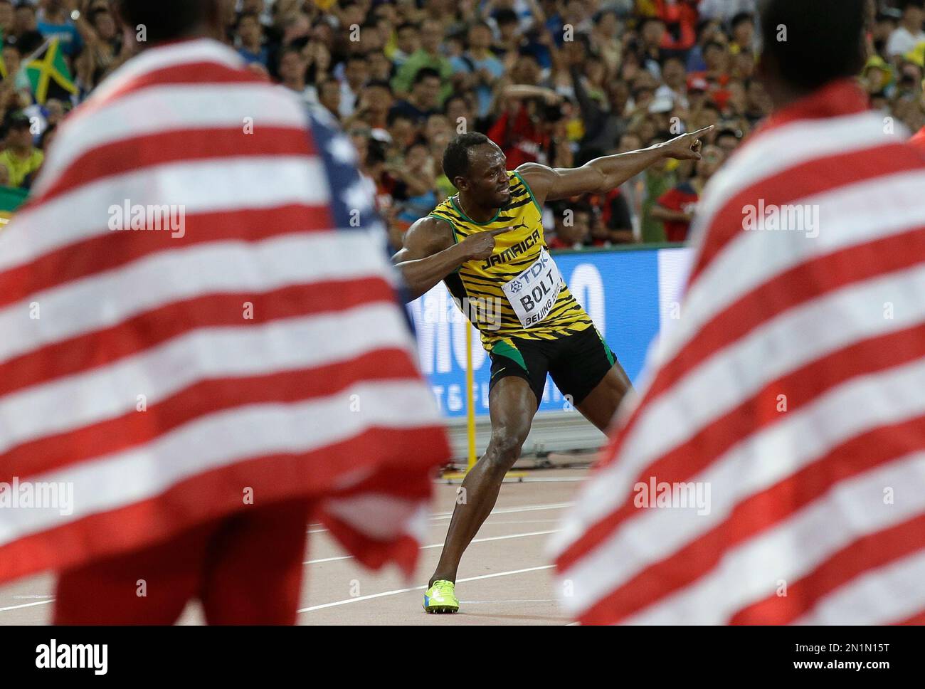 Jamaica's Usain Bolt strikes a pose for the cameras after winning the ...