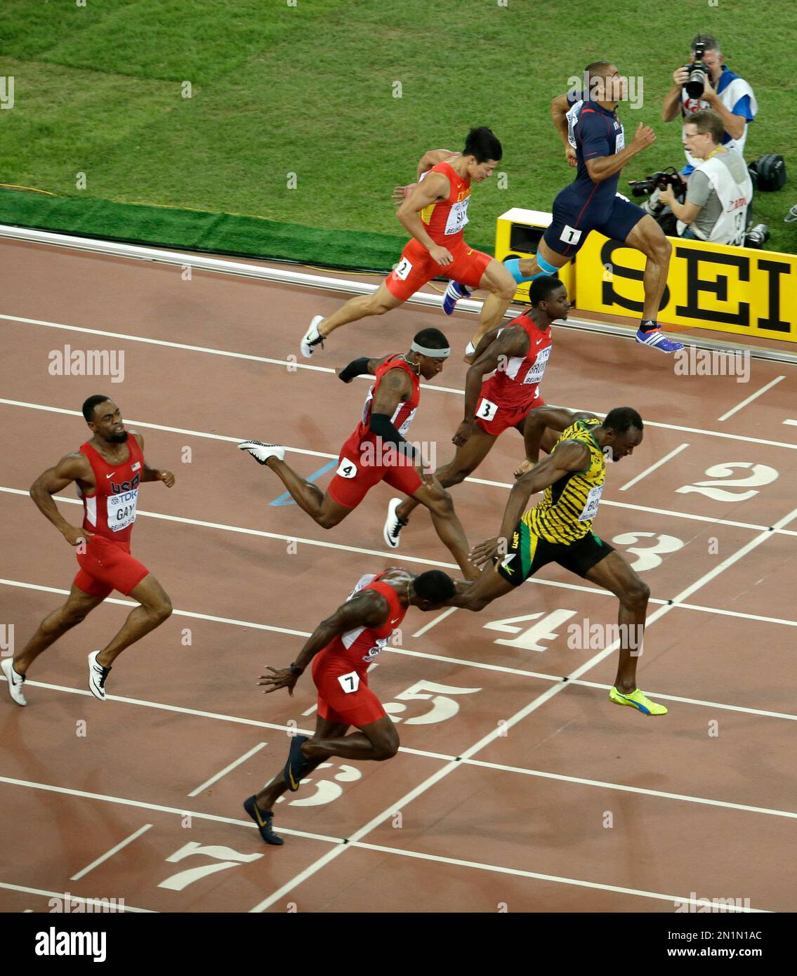Jamaica's Usain Bolt, right, wins the gold medal in the men's 100m ...