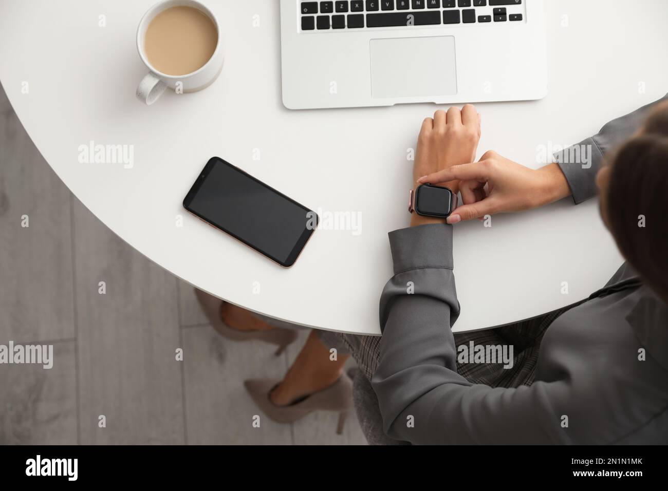 Indoors table watch woman hi-res stock photography and images - Alamy