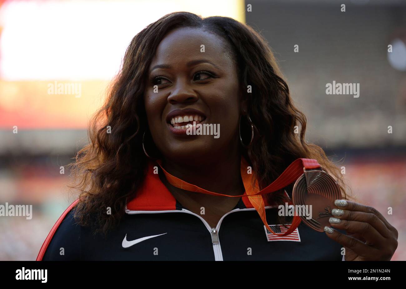 United States' Michelle Carter on the podium with her bronze medal won ...