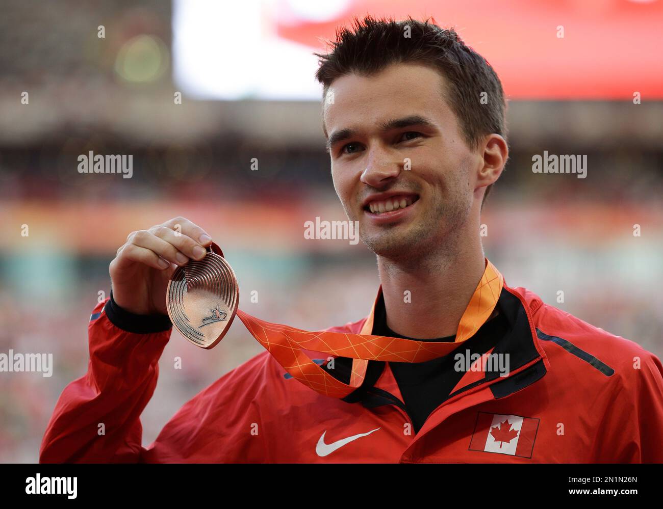 Canada's Benjamin Thorne poses with his bronze medal of the men's 20k ...