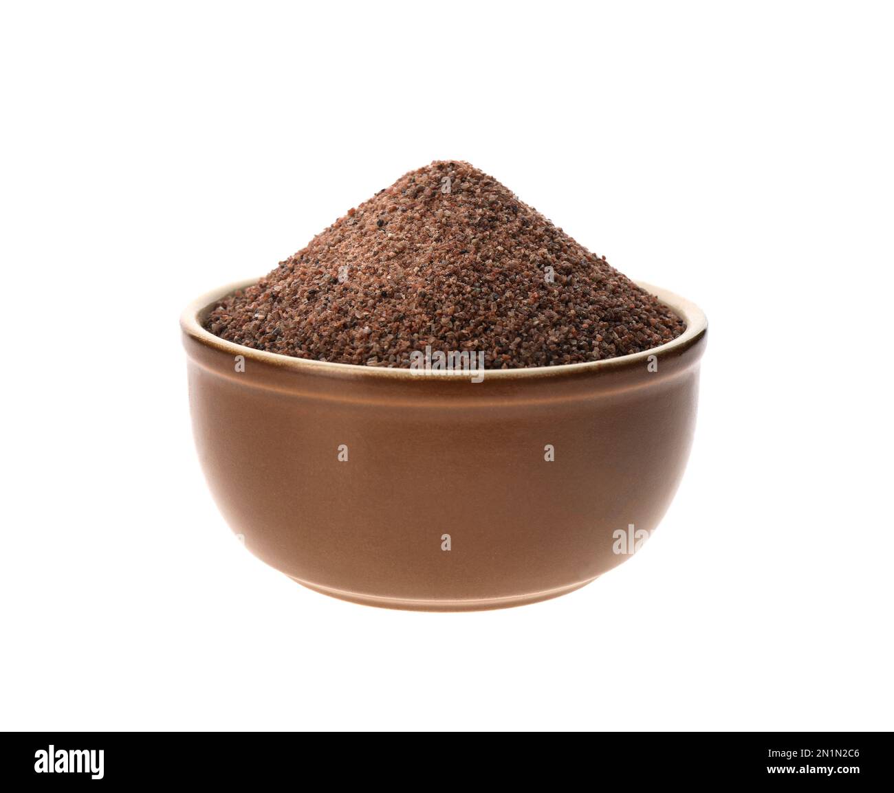 Ground black salt in bowl isolated on white Stock Photo - Alamy