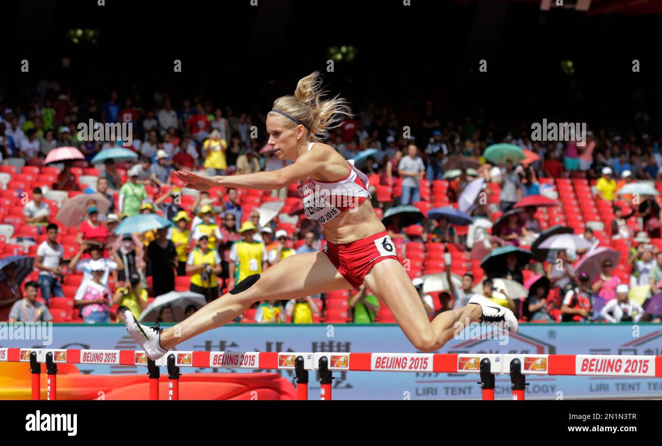 Denmark's Sara Slott Peterson clears a hurdle during the women's 400m ...