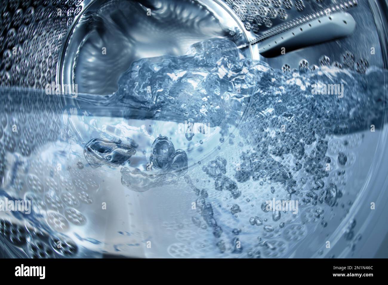 Washing machine drum with water, closeup view Stock Photo - Alamy