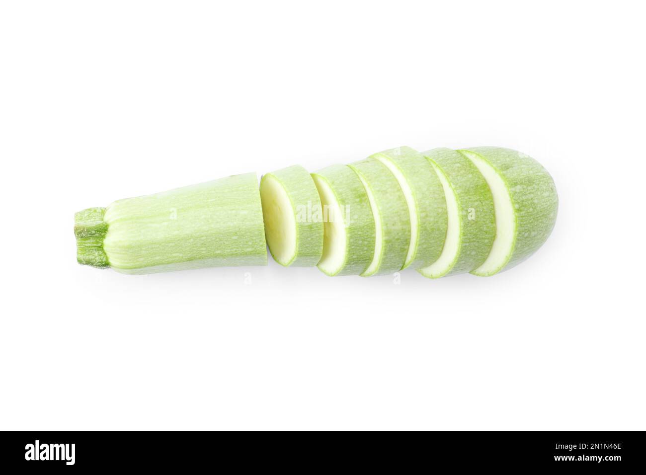 Cut green ripe zucchini isolated on white, top view Stock Photo - Alamy