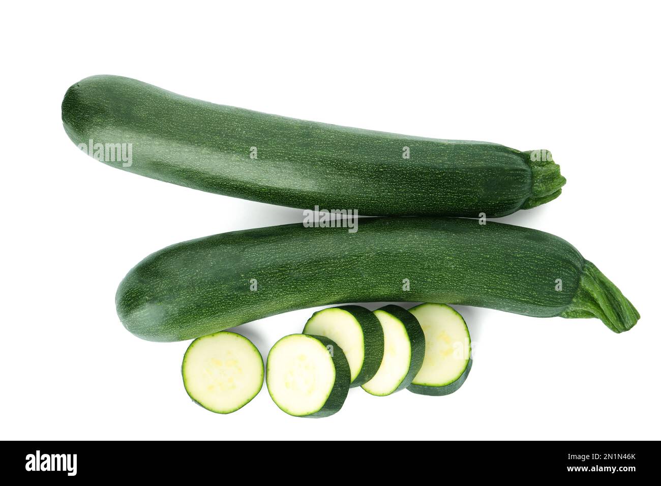 Cut and whole green ripe zucchini isolated on white, top view Stock ...