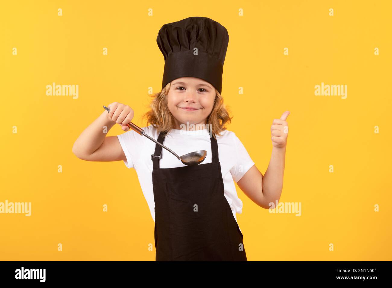Funny kid chef cook with kitchen ladle, studio portrait. Kid chef cook ...