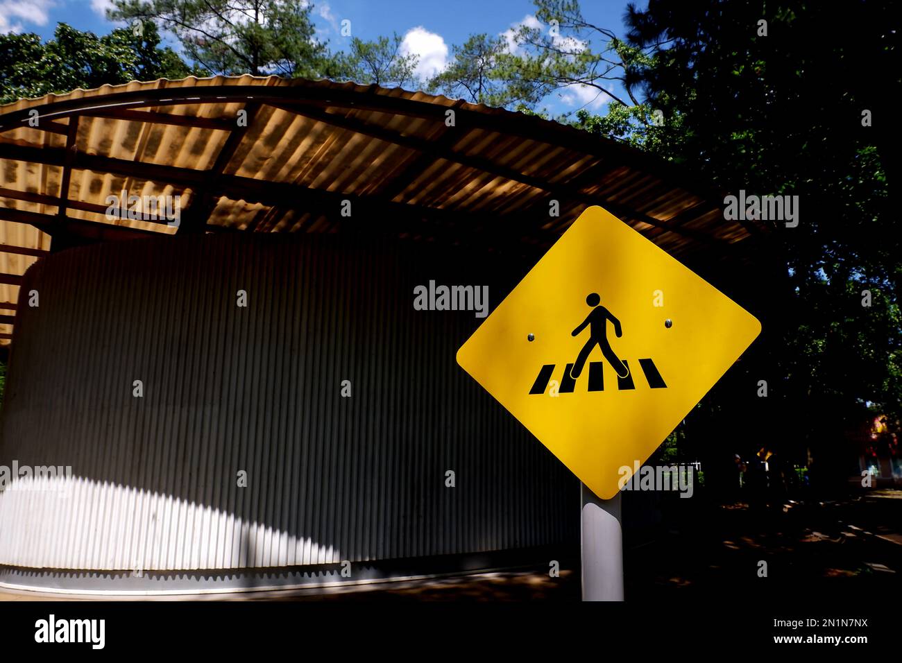 yellow sign people walking with the surrounding environment Stock Photo ...