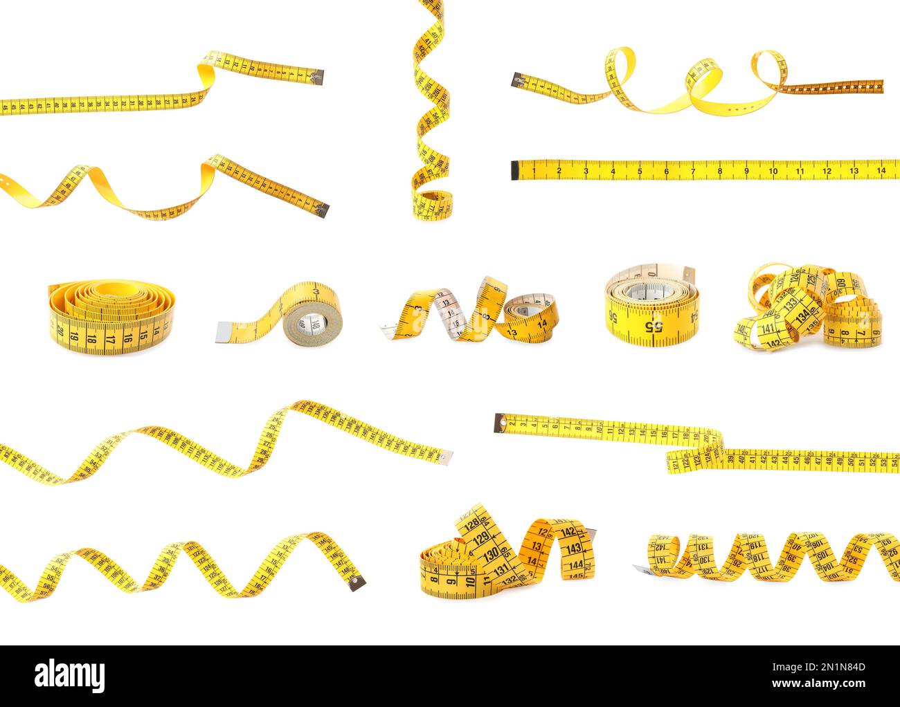 Set of yellow measuring tapes on white background Stock Photo - Alamy