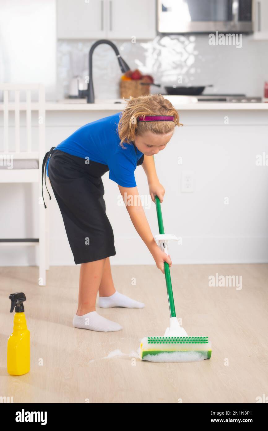 Kid helping with housework, cleaning. Children helping with ...