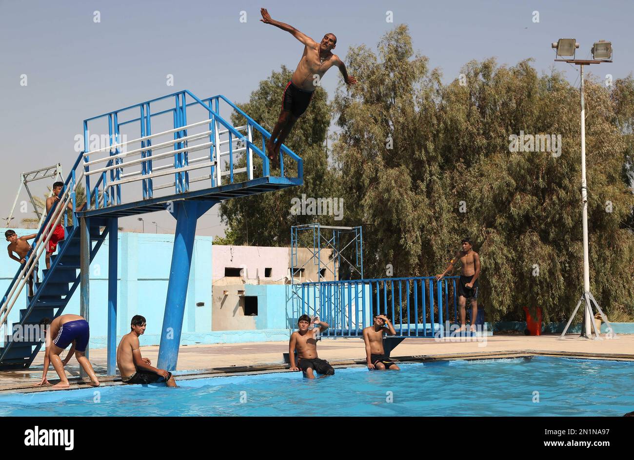 Iraqis swim in a public swimming pool in Baghdad, Iraq, Saturday, Aug ...