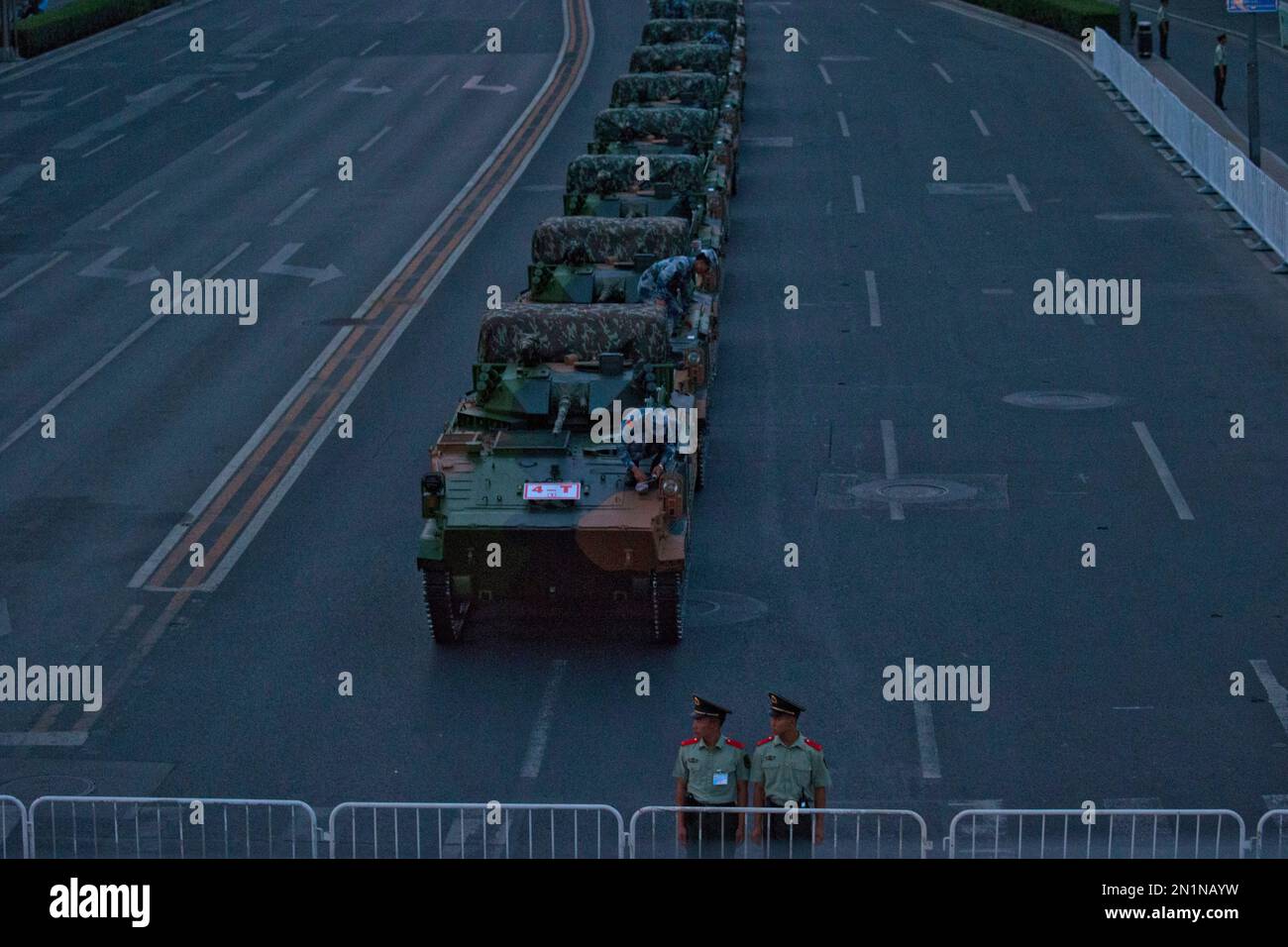 Chinese paramilitary policemen stand guard as a line of air portable ...