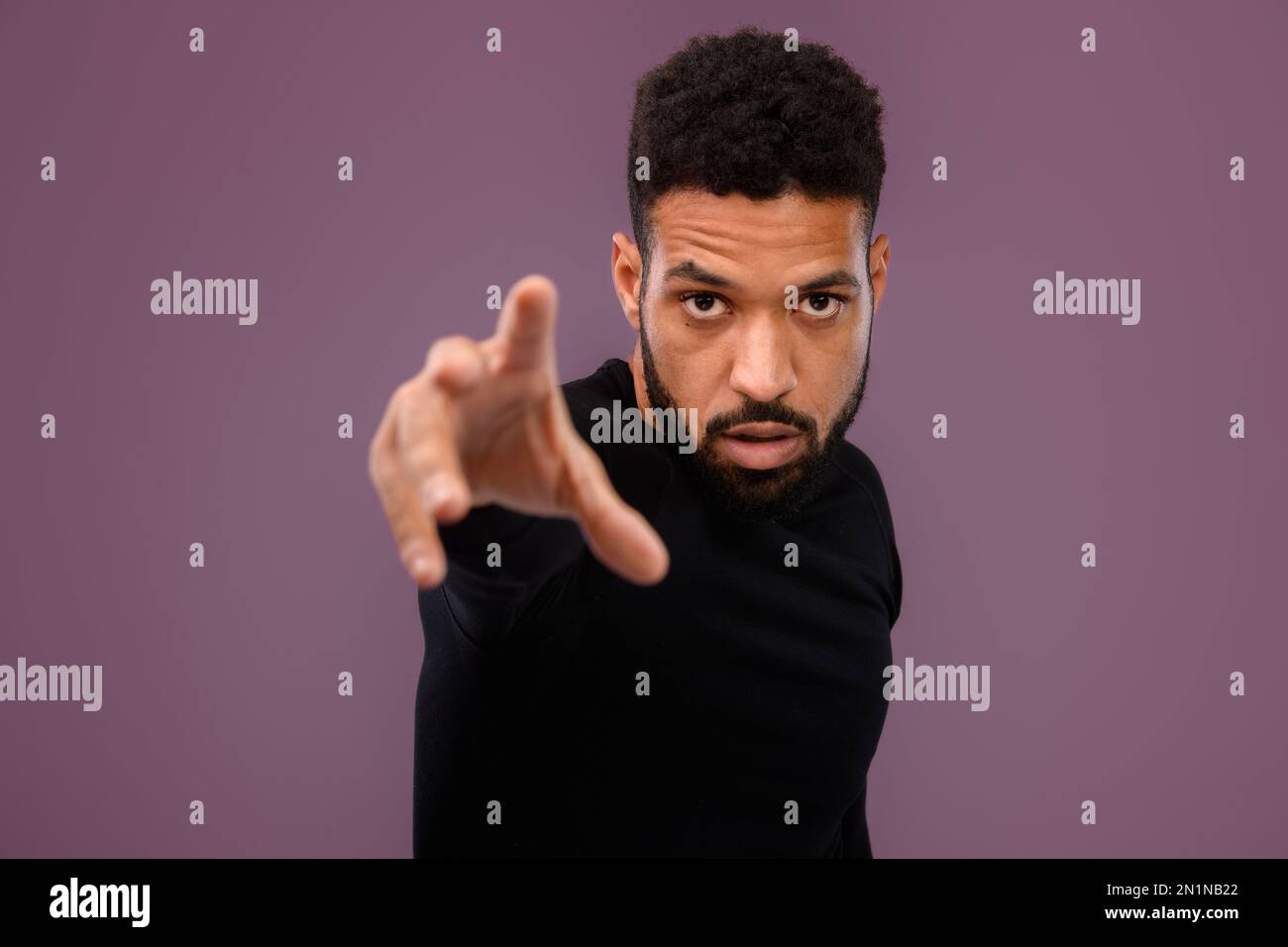 Portrait of young multiracial man in studio Stock Photo - Alamy