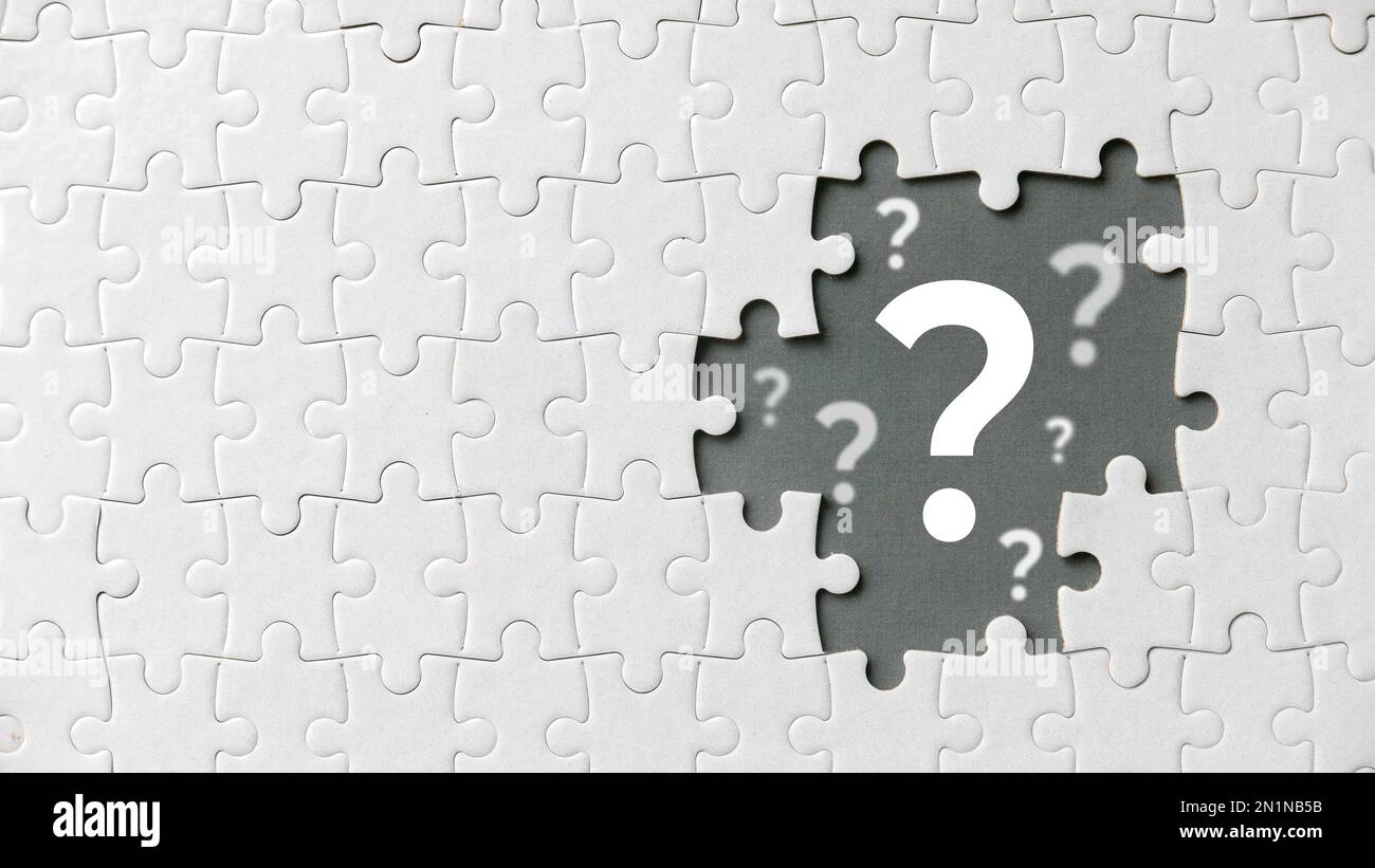 Top view of an empty space of jigsaw puzzle fill with question symbol ...
