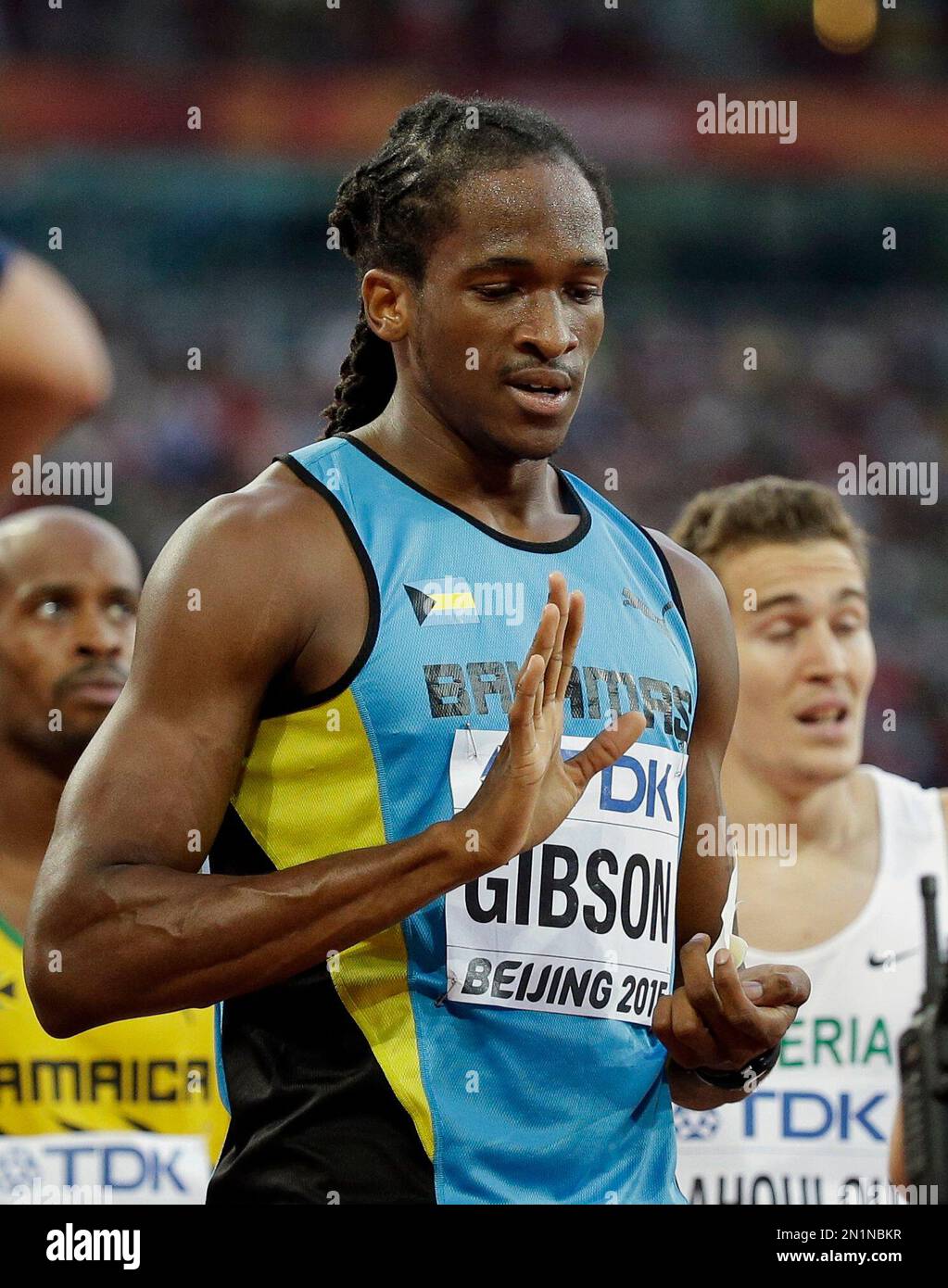 Bahamas' Jeffery Gibson reacts after running in a men’s round one heat ...