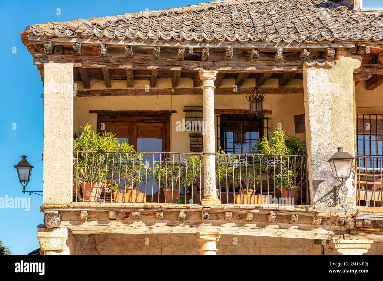 Typical balcony of the medieval town of stonework in stone building ...