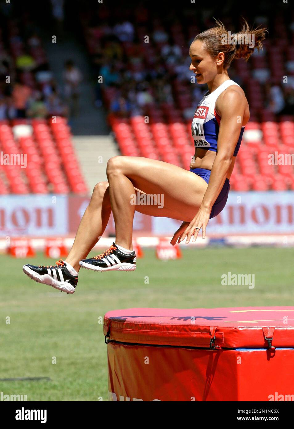 Britain's Jessica Ennis-Hill jumps from the mat after making a ...