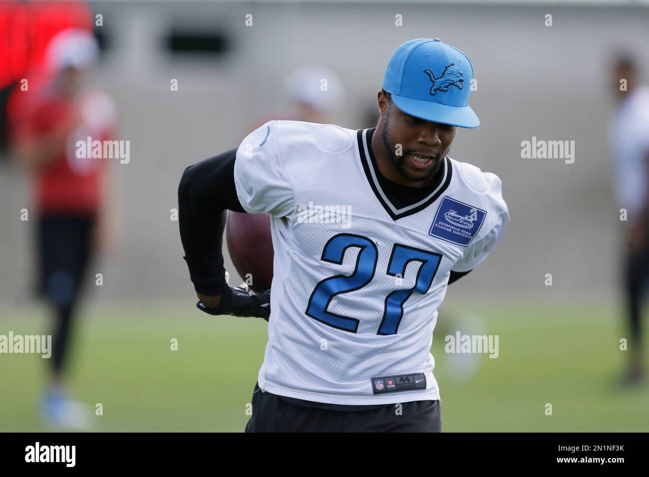 Detroit Lions free safety Glover Quin runs a drill at an NFL football ...