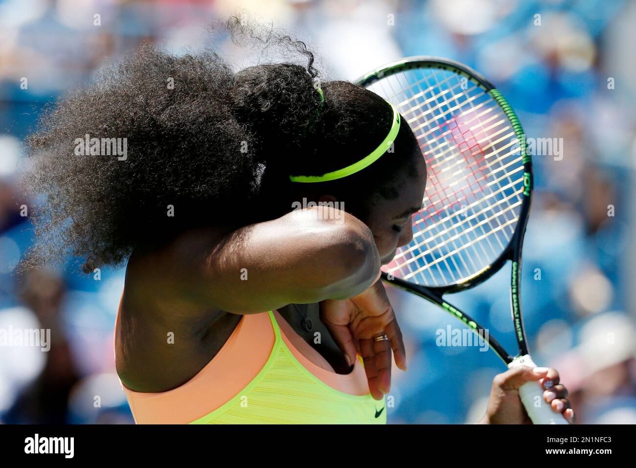 Serena Williams wipes sweat from her face during a quarterfinal match ...